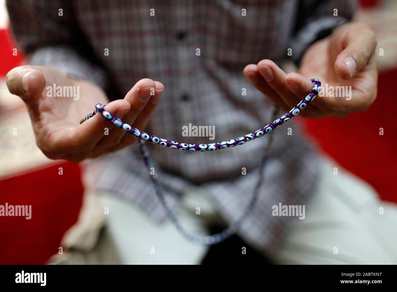 Muslim man praying with prayer beads (Masbahah ). Close-up Stock Photo ...