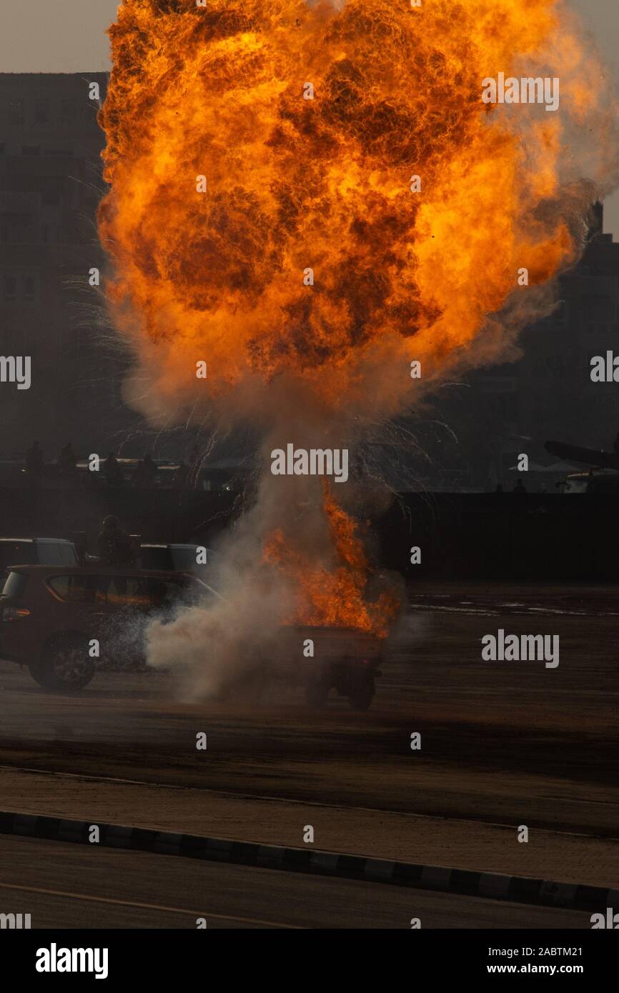 Military strike or bomb on a car in war causes fire ball and explosion ...