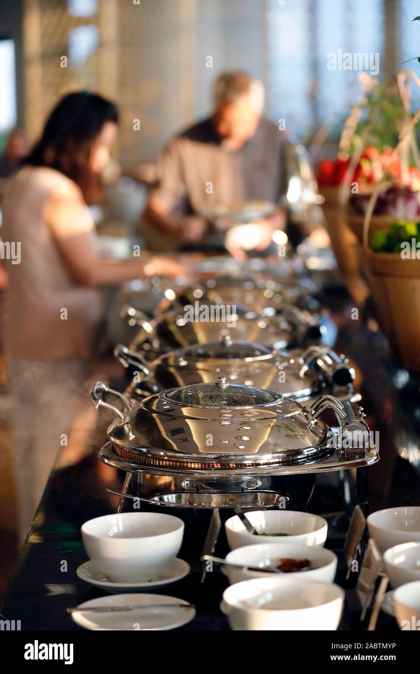Man And Woman In The Breakfast Buffet In The Hotel High Resolution ...