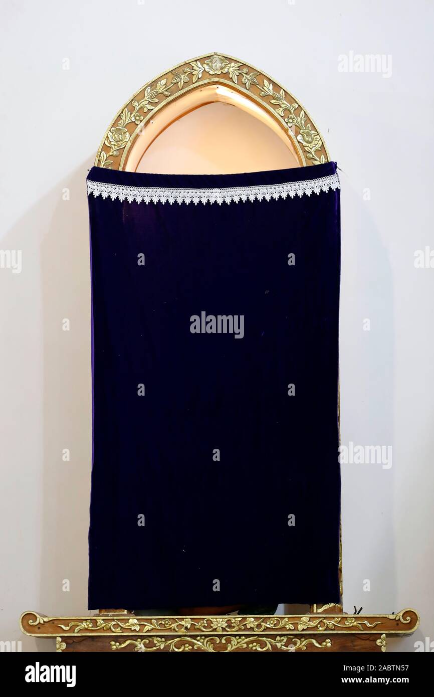 A crucifix is veiled for Lent. Hoi An Cathedral. Vietnam Stock Photo ...