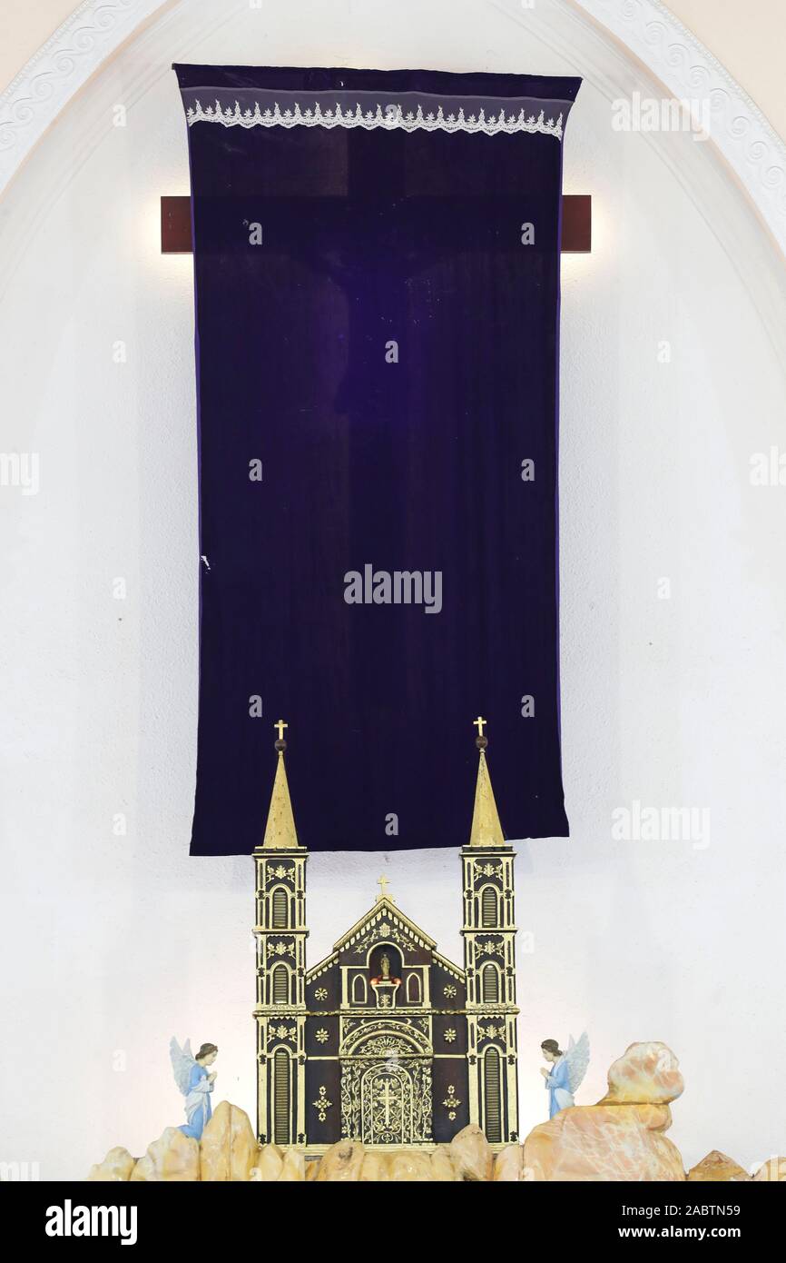 A crucifix is veiled for Lent. Hoi An Cathedral. Vietnam Stock Photo ...