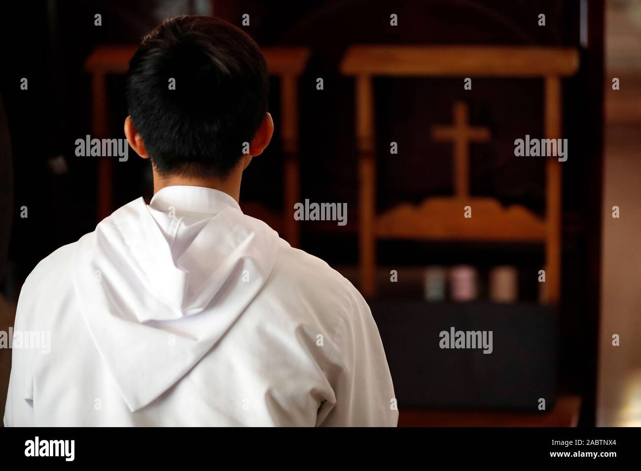 Back view of person praying in church hi-res stock photography and ...