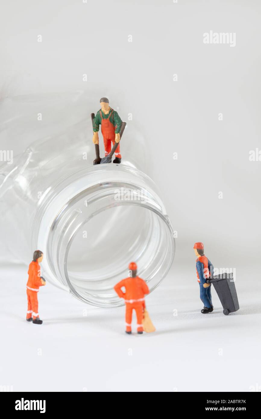 Miniature Garbage man recycling and cleaning a soft drink can to ...