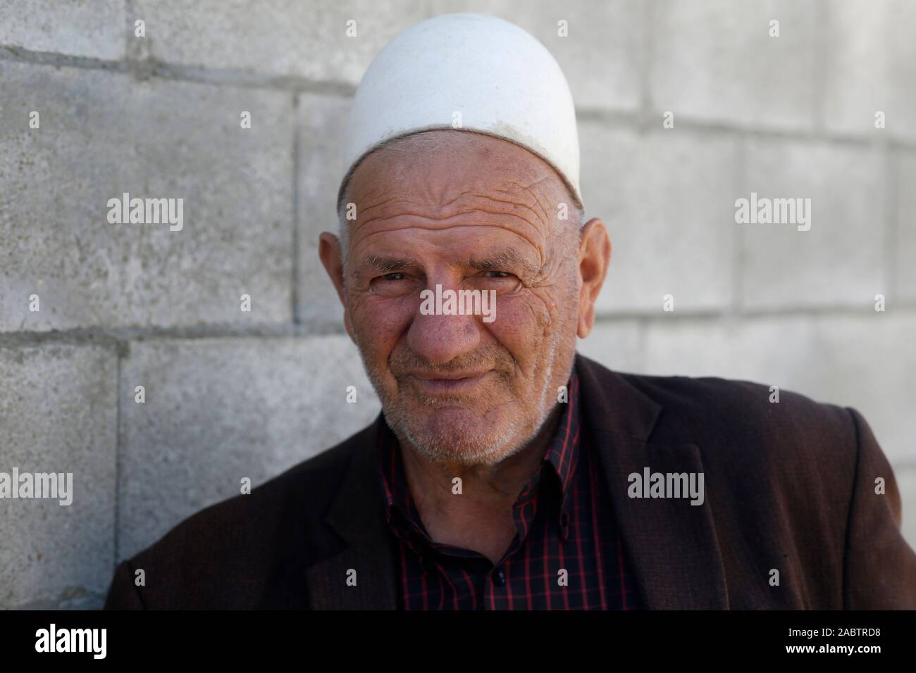 Kosovar wearing a traditional hat in Pec, Kosovo Stock Photo - Alamy