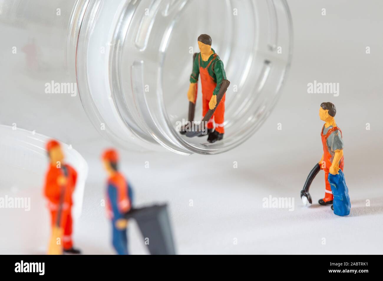 Miniature Garbage man recycling and cleaning a soft drink can to ...