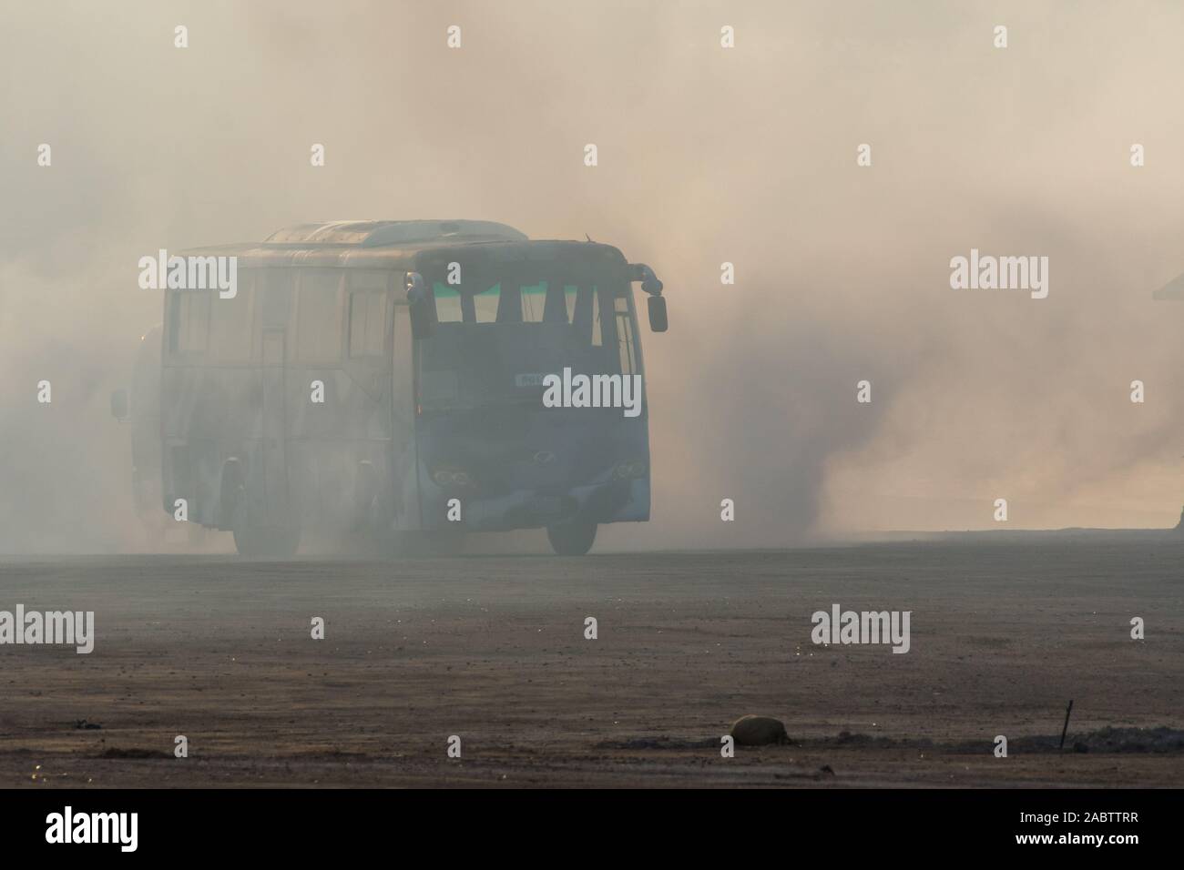 Military police riot bus response to a protest with tear gas, smoke ...