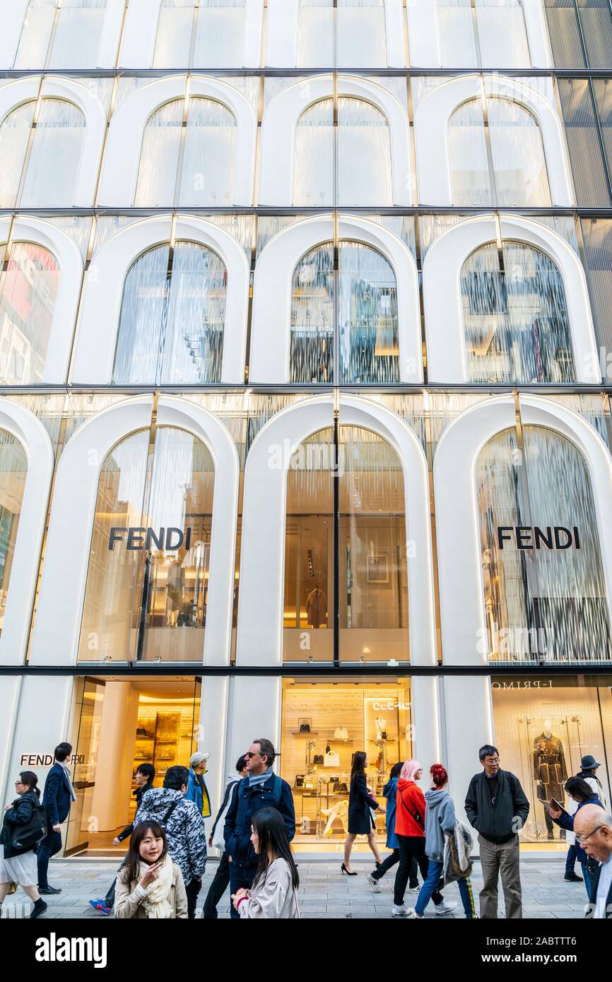 Tokyo, the Ginza. Daytime. Street view of the mainly glass facade ...