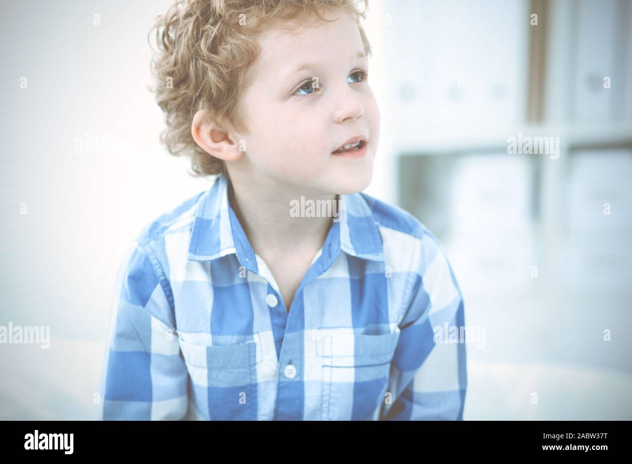 Doctor and patient child. Physician examining little boy. Regular ...