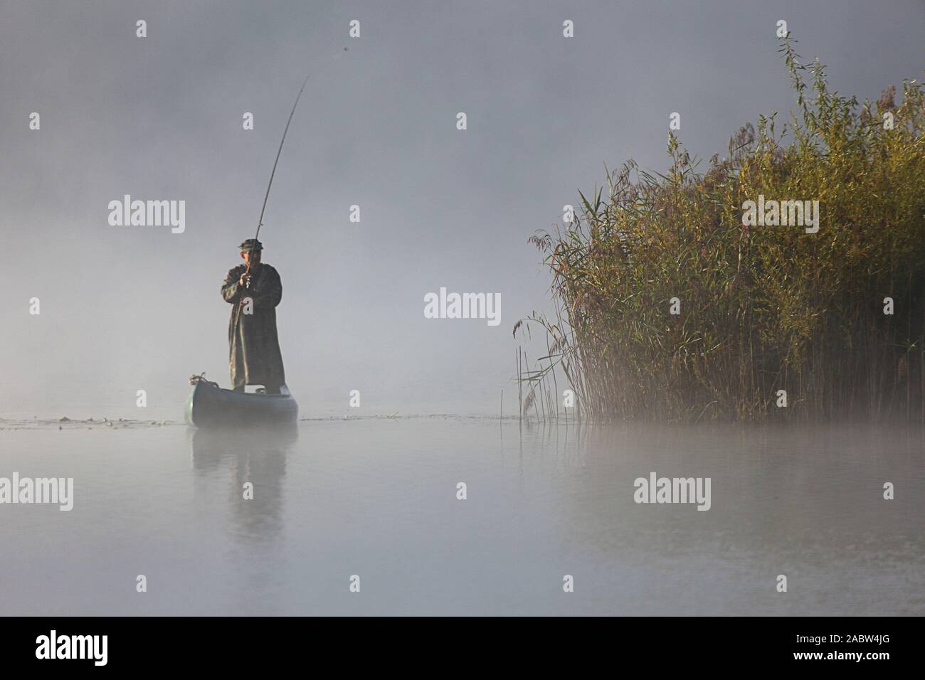 Fisherman in morning mist hi-res stock photography and images - Alamy
