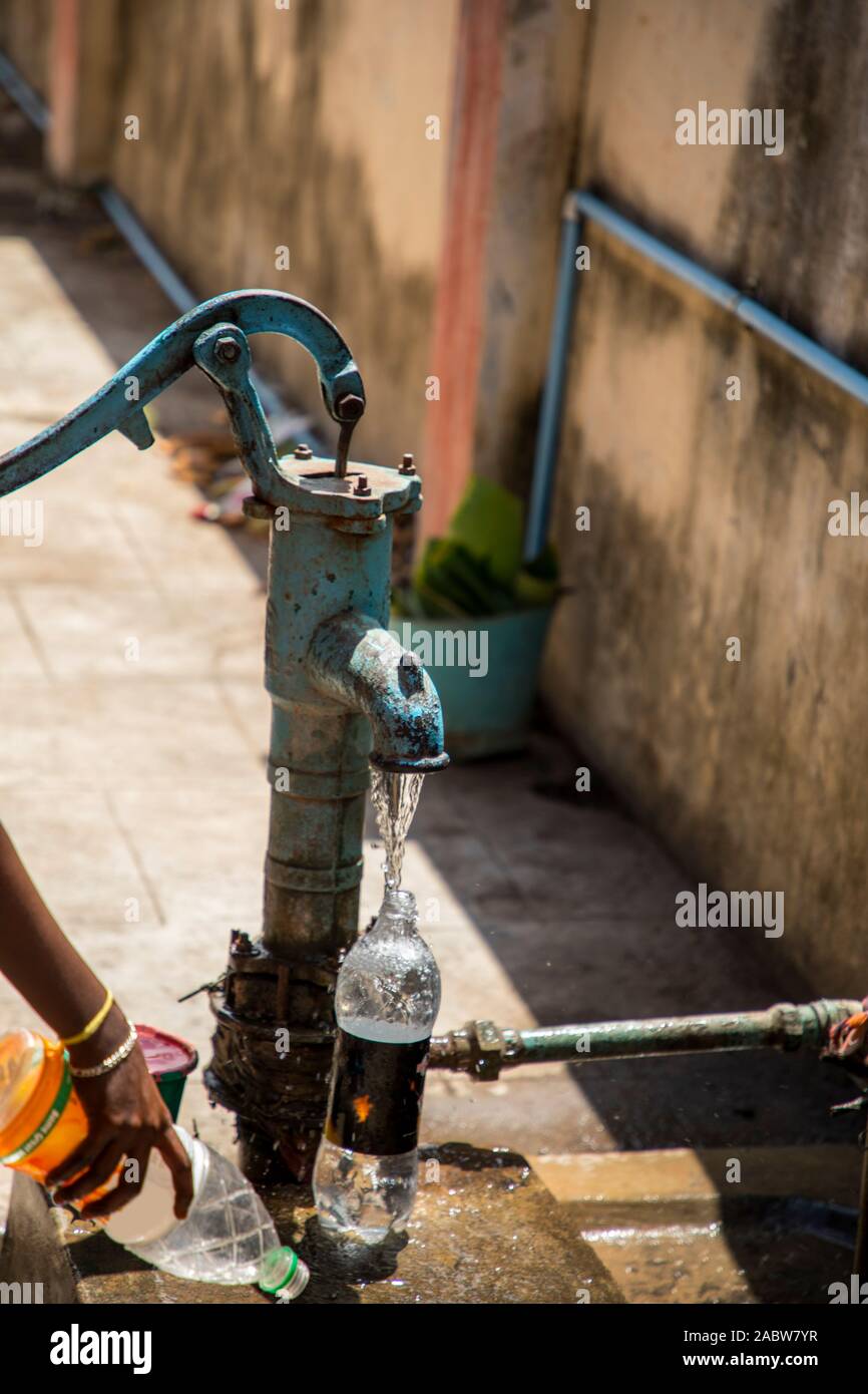 Old water pump from metal background Stock Photo - Alamy