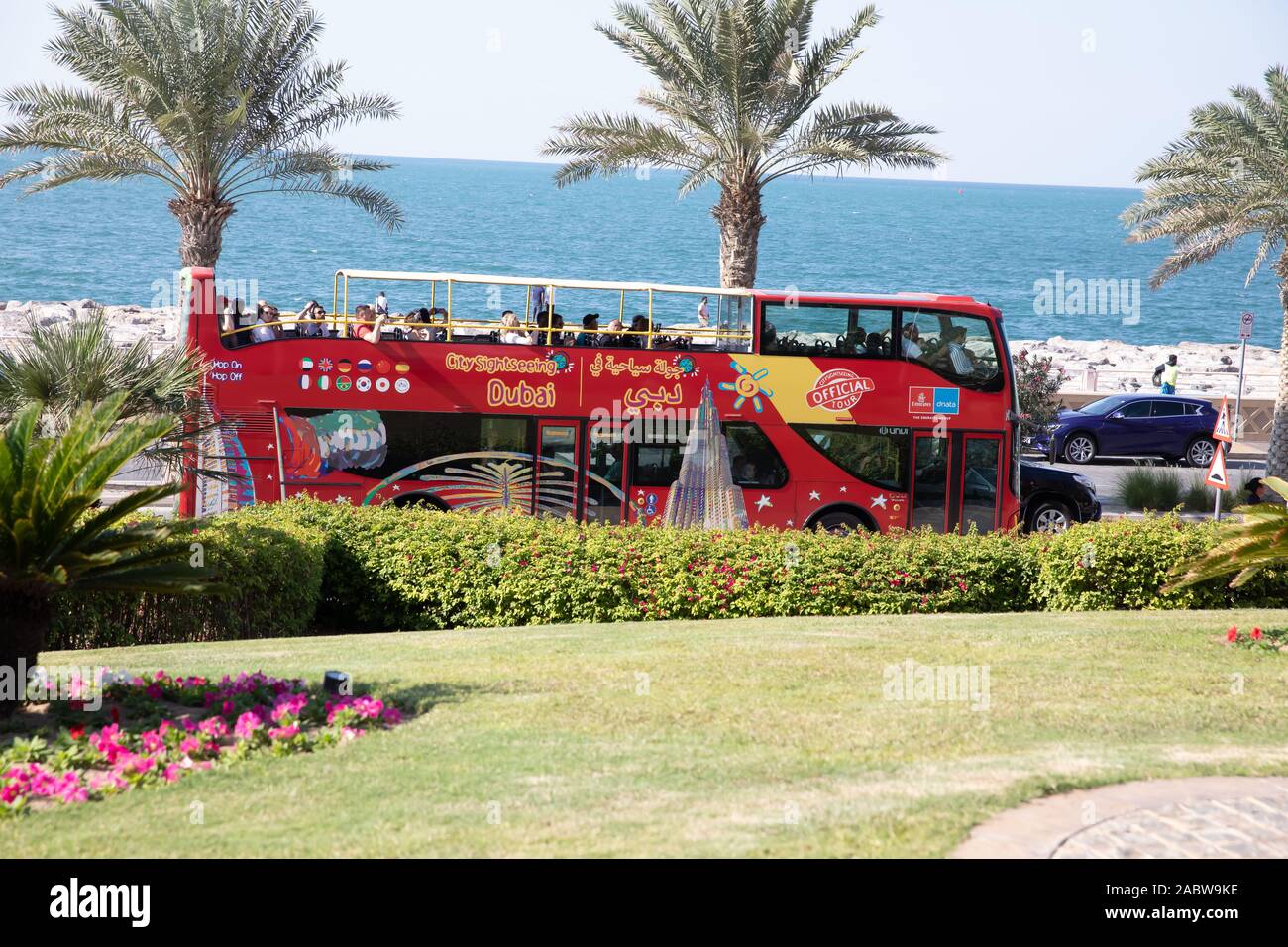 Citysightseeing bus passing the Atlantis Hotel, on the palm in Dubai ...