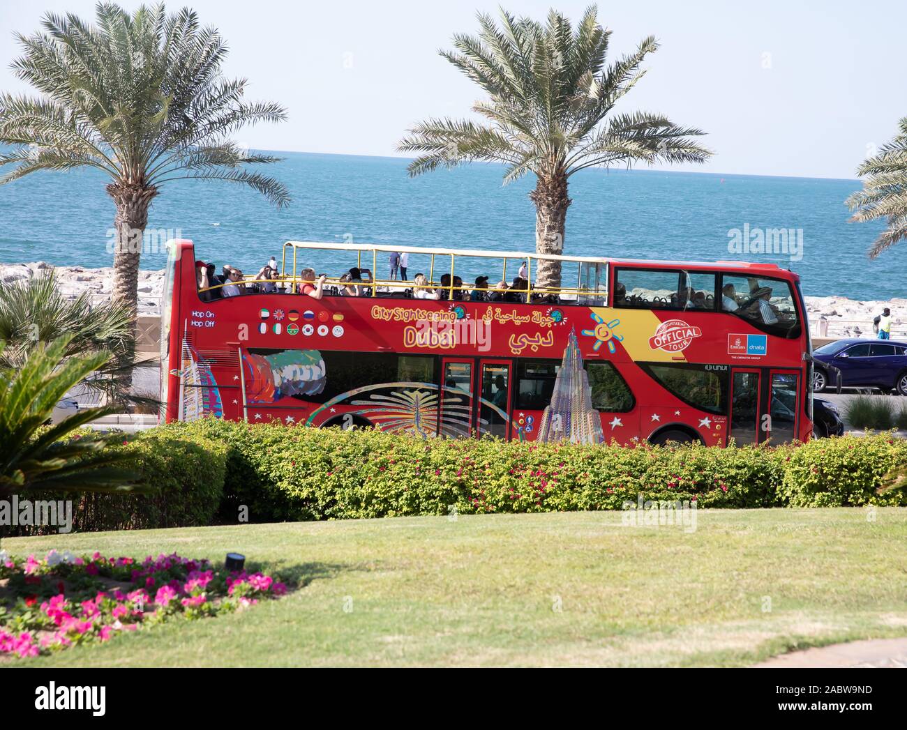 Citysightseeing bus passing the Atlantis Hotel, on the palm in Dubai ...