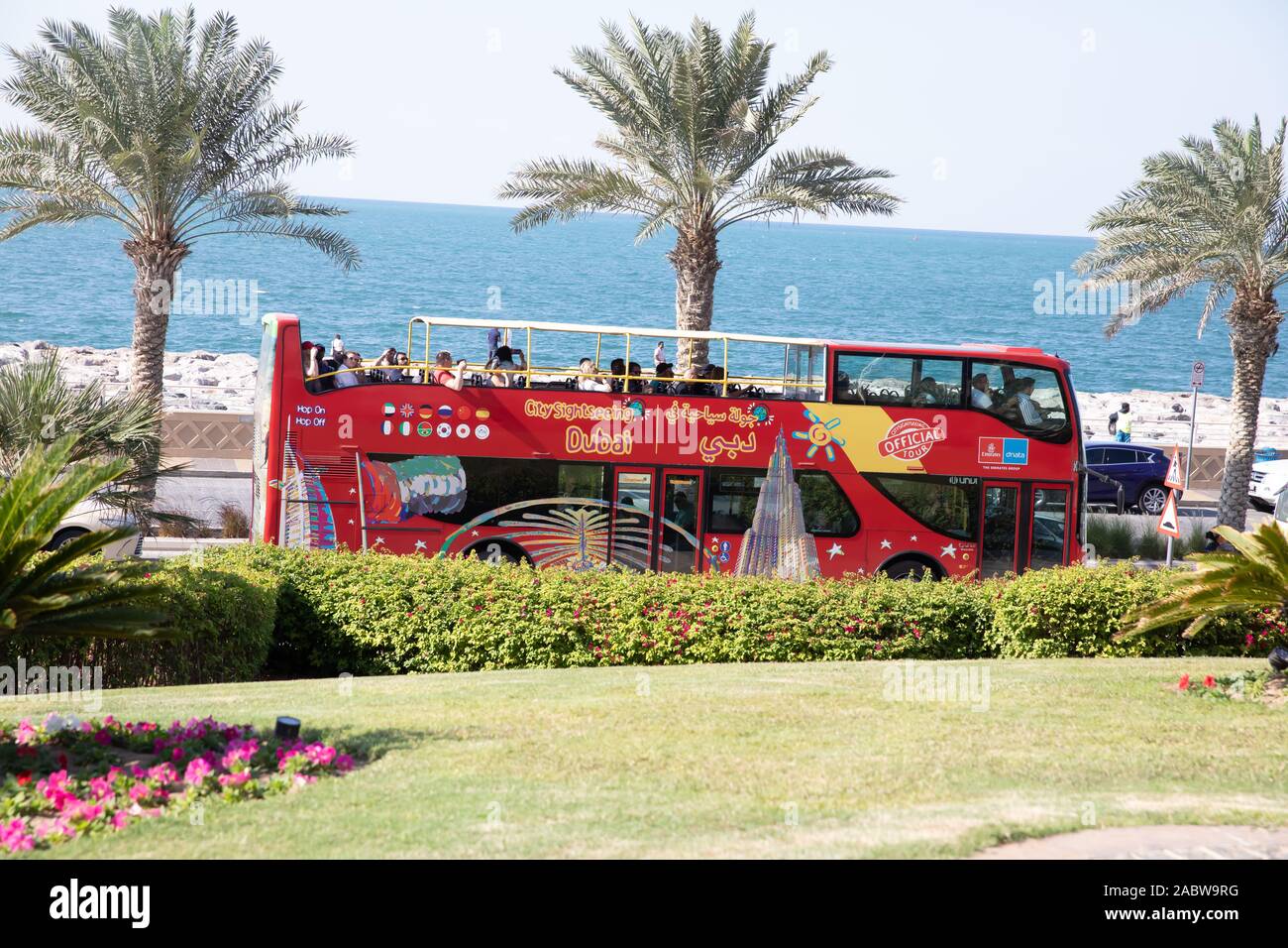 Citysightseeing bus passing the Atlantis Hotel, on the palm in Dubai ...