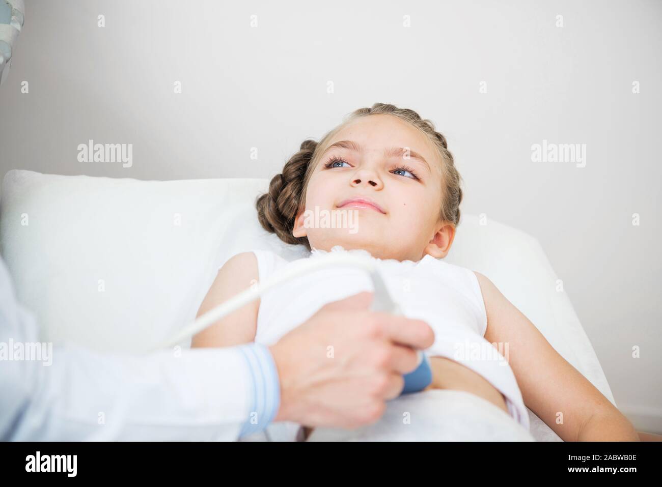 Medical examination of smiling little girl Stock Photo - Alamy