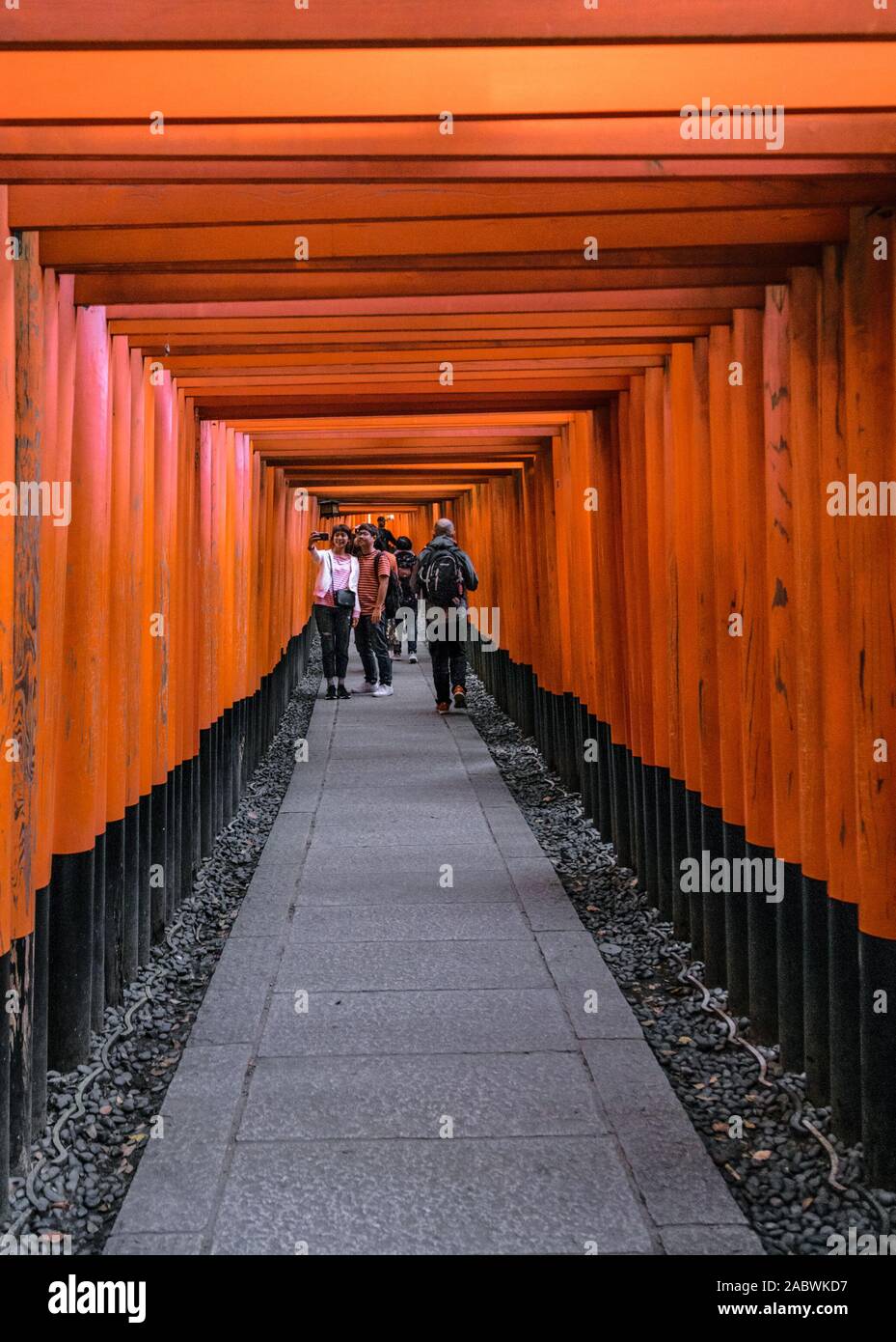 Tourists taking photos in the iconic Fushimi Inari Shrine, the most ...
