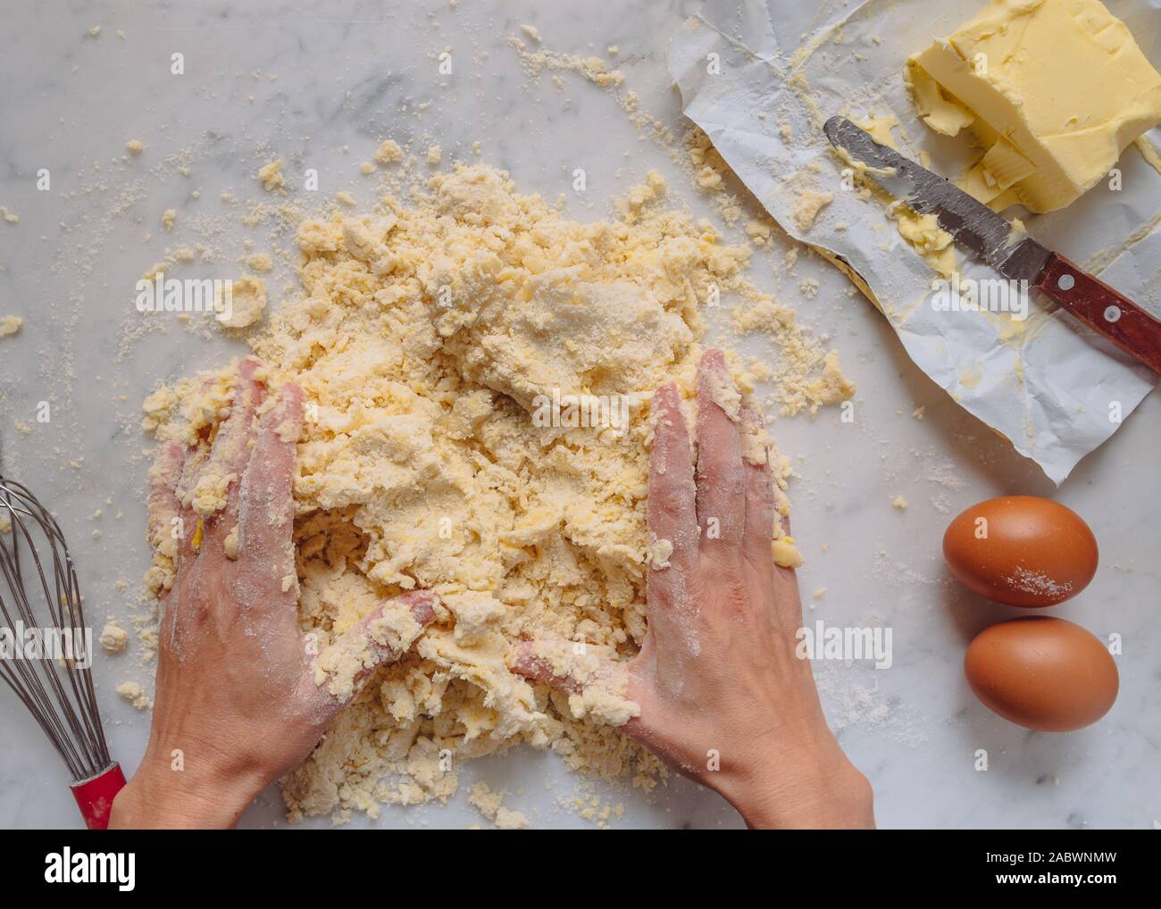 making dough, caucasian woman hands making a dough with flour eggs and ...