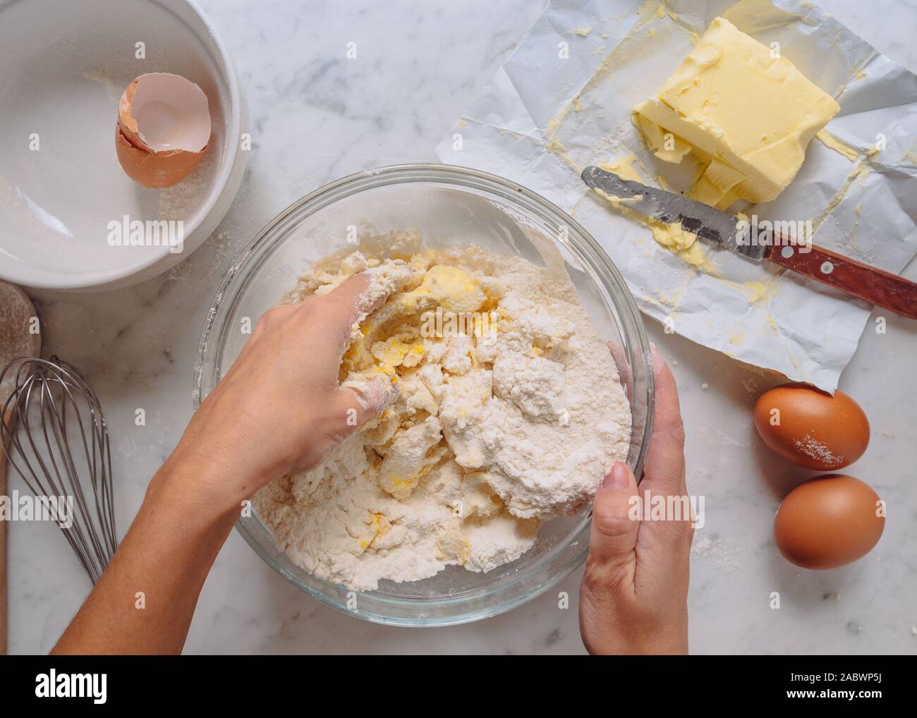 making dough, caucasian woman hands making a dough with flour eggs and ...