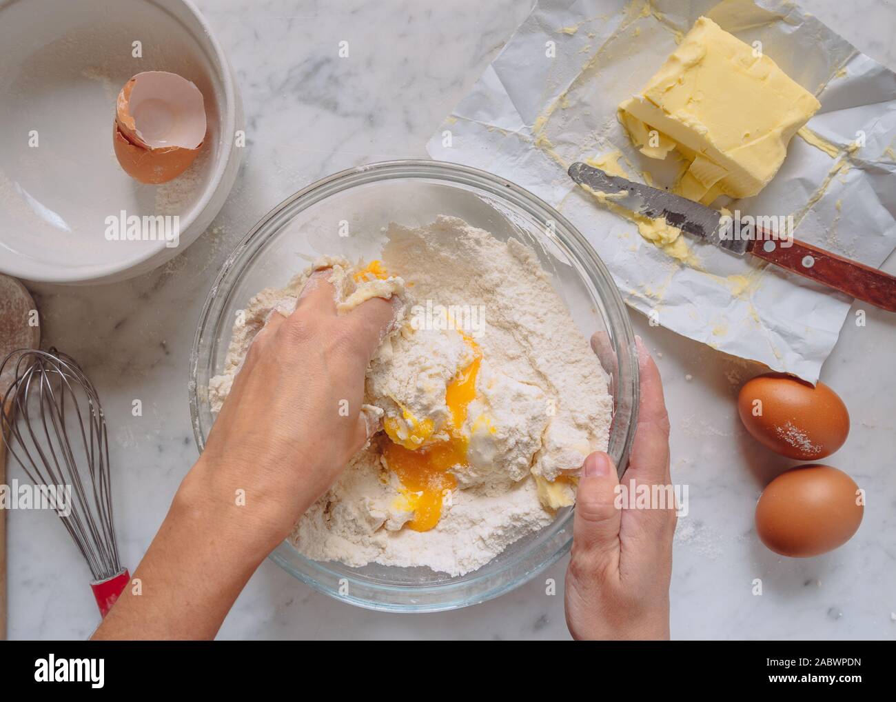 making dough, caucasian woman hands making a dough with flour eggs and ...