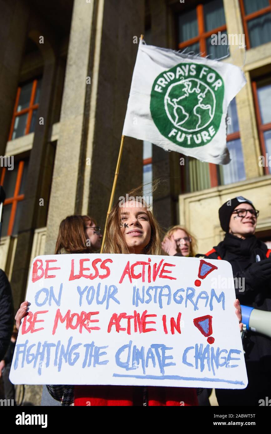 A student holds a placard during the global climate strike day to ...