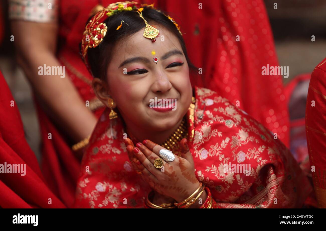 Kathmandu, Nepal. 29th Nov, 2019. A girl from Newar community gestures ...
