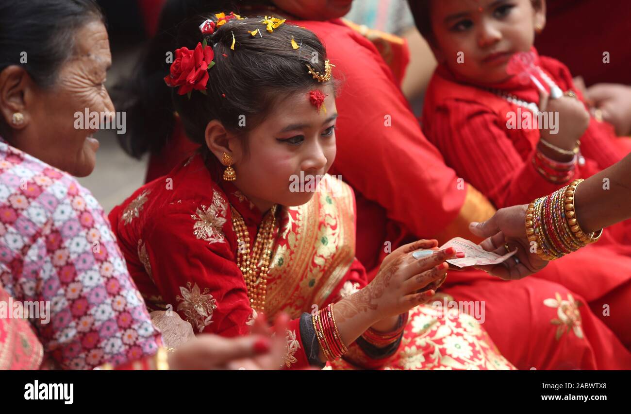Kathmandu, Nepal. 29th Nov, 2019. A girl from Newar community gestures ...