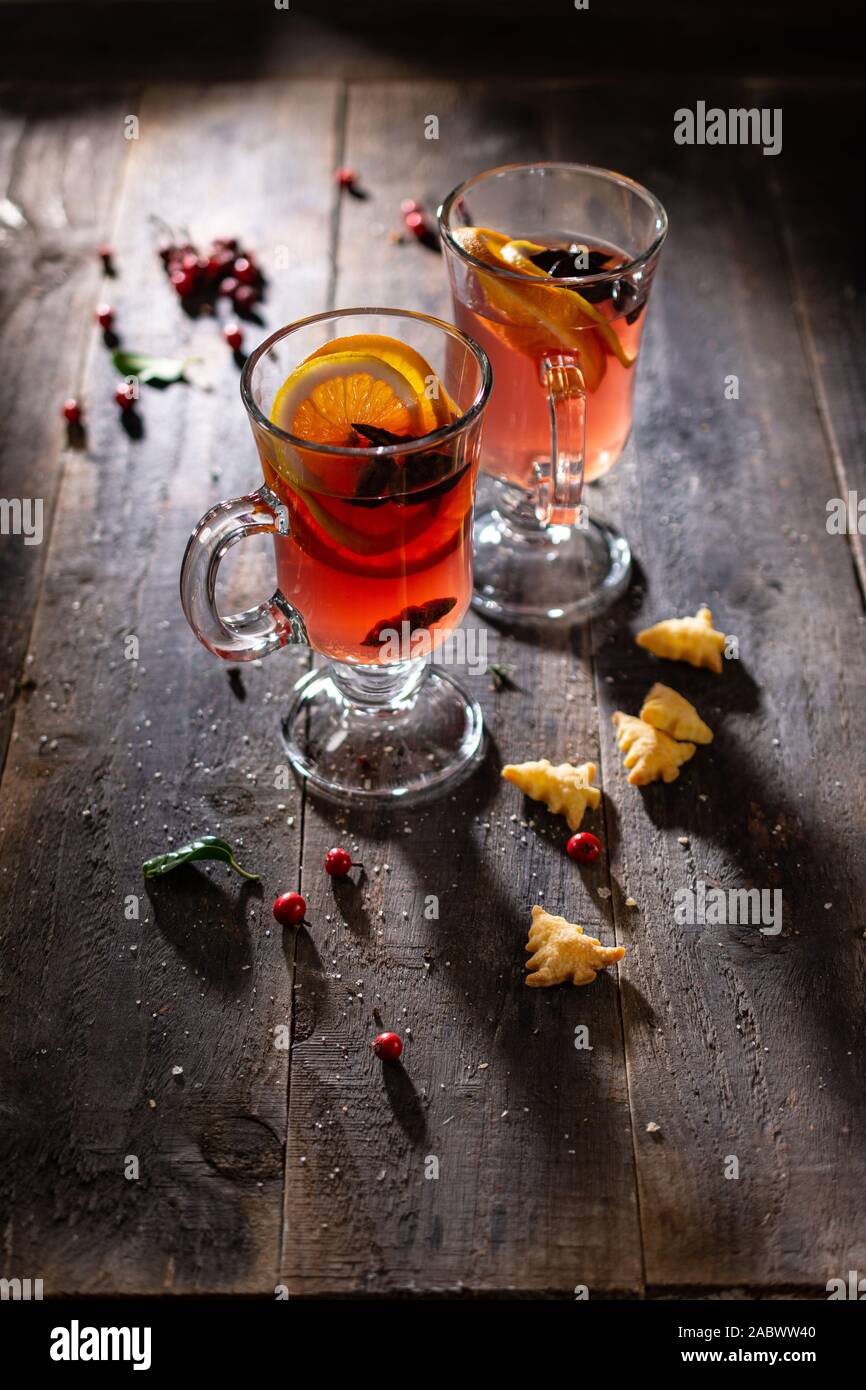 Winter tea with orange lemon and spice.Fruit sweet treats on a festive ...