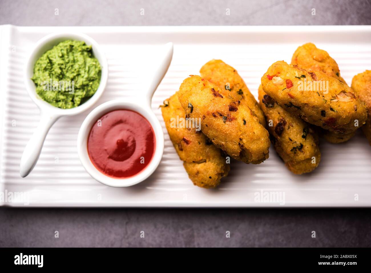 Veg Poha Cutlet or flattened Rice Patties served with tomato ketchup ...