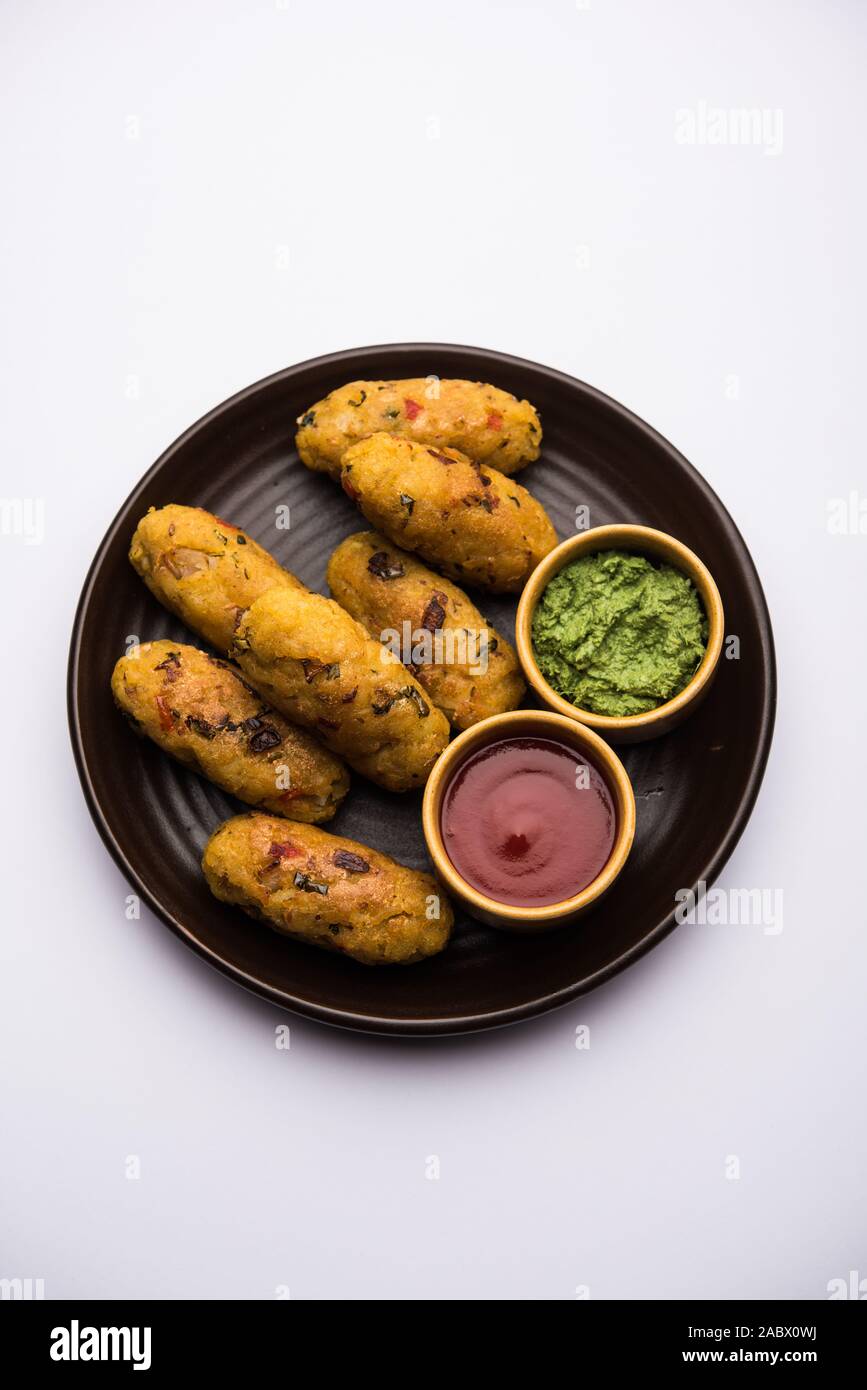 Veg Poha Cutlet or flattened Rice Patties served with tomato ketchup ...