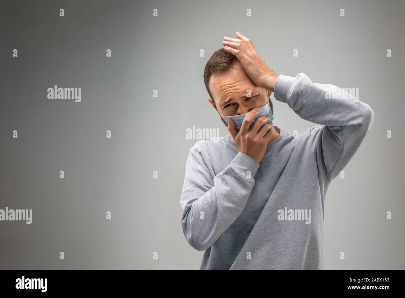 Can't breathe. Caucasian man wearing the respiratory protection mask ...