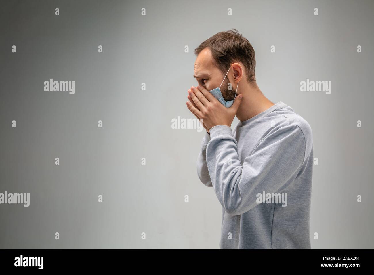 Can't breathe. Caucasian man wearing the respiratory protection mask ...