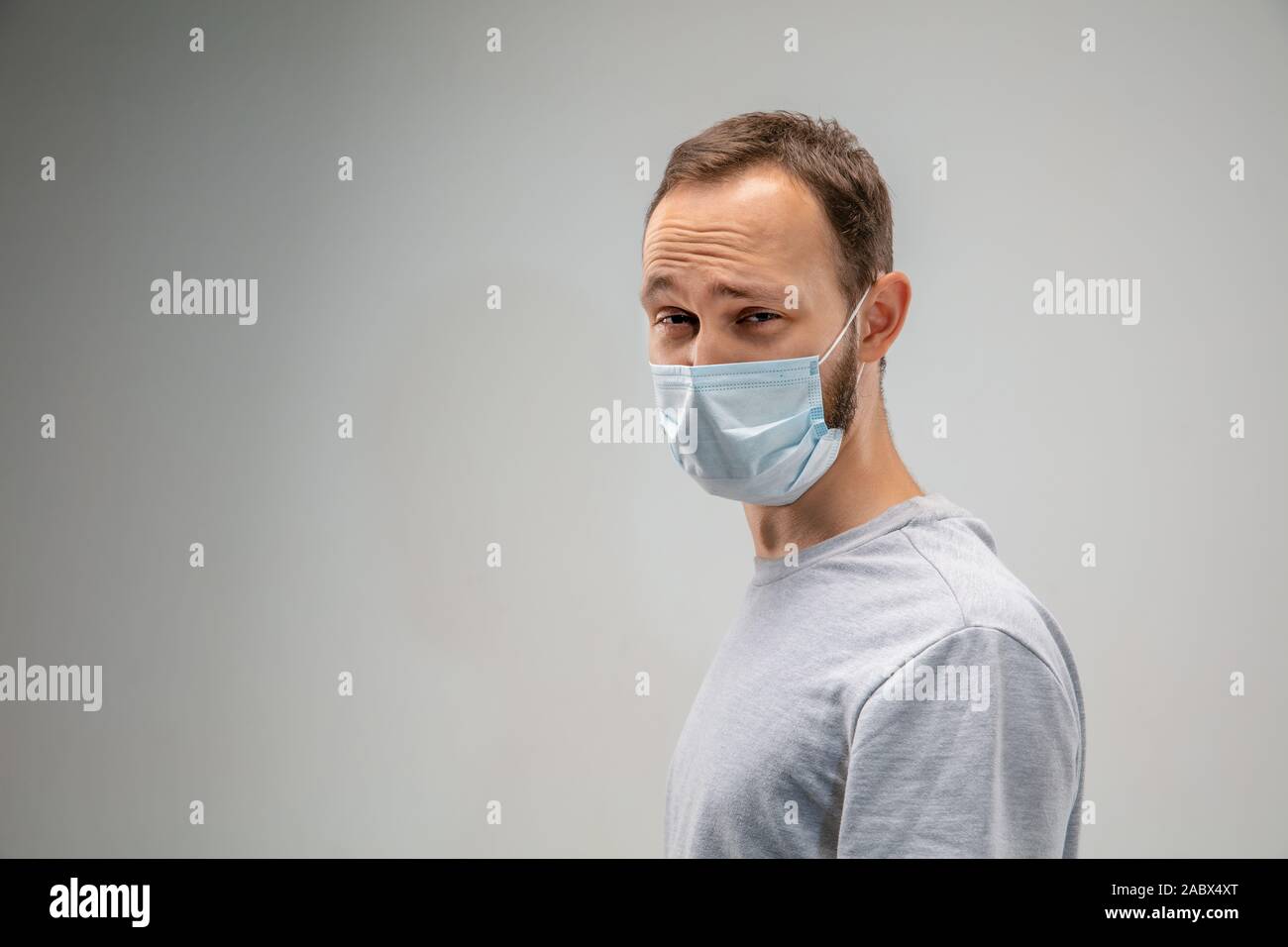 Can't breathe. Caucasian man wearing the respiratory protection mask ...