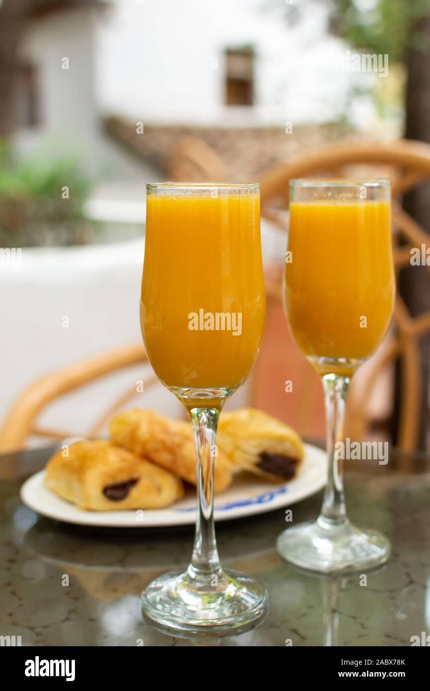 Healthy breakfast with two glasses of freshly squeezed orange juice ...