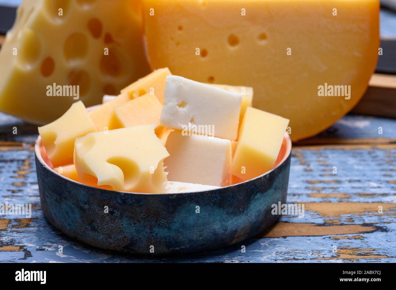 Tasty snacks, cheese blocks from Dutch yellow gouda and white goat hard ...