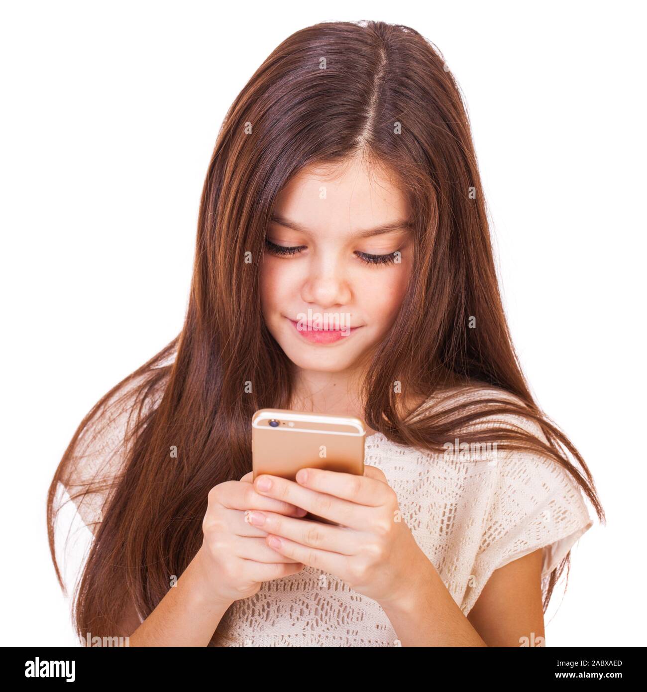 Portrait of positive little girl hold her cellphone true addicted ...