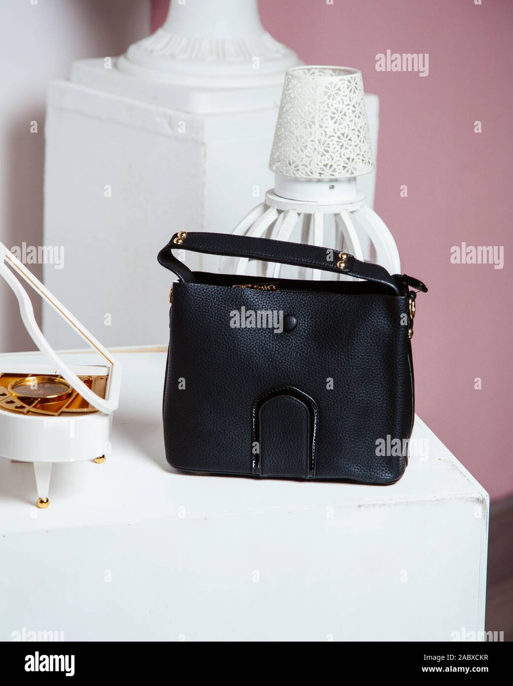 small black leather bag for woman Stock Photo - Alamy