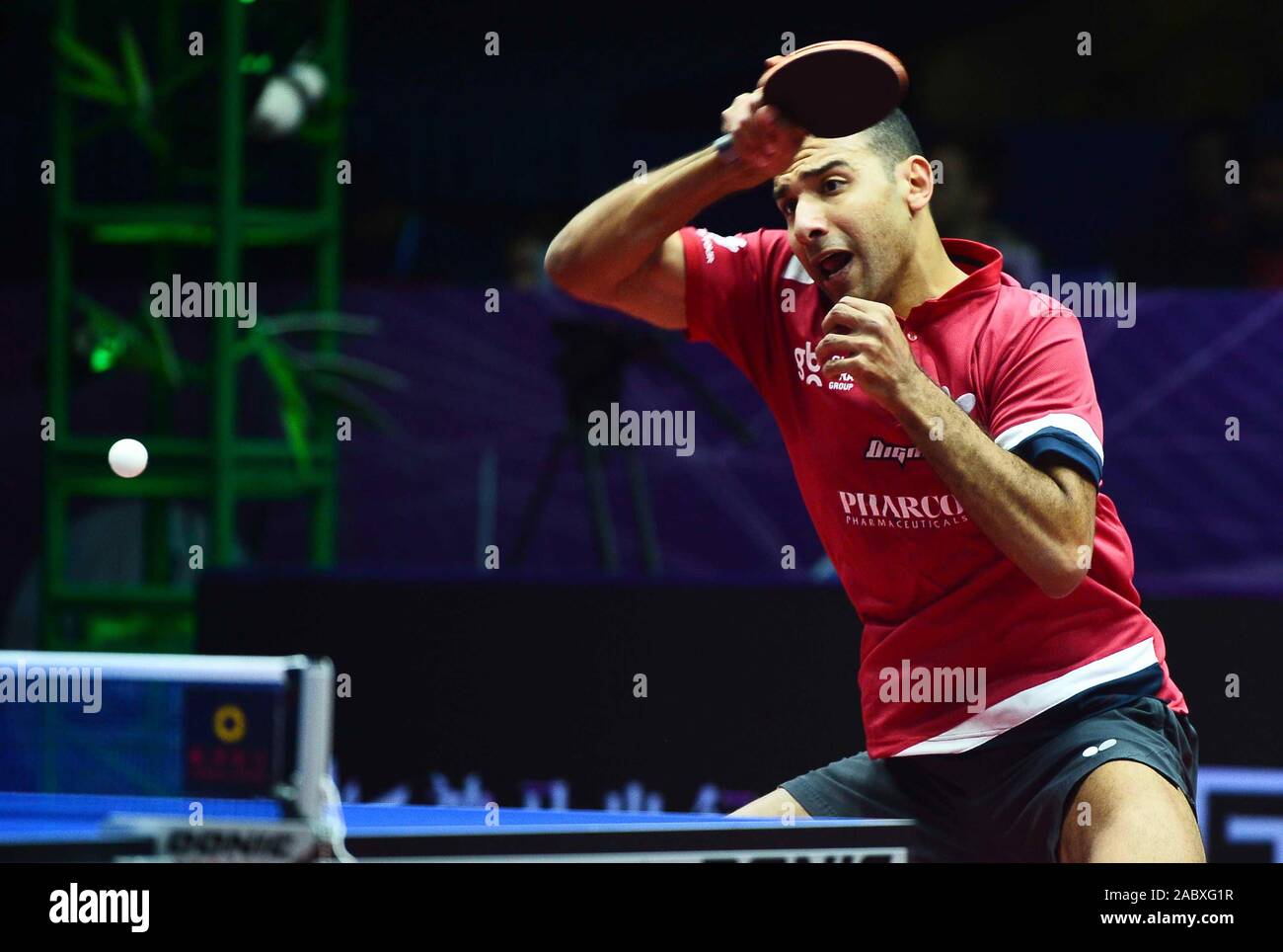 Omar Assar of Egypt returns a shot against Kanak Jha of USA in their ...