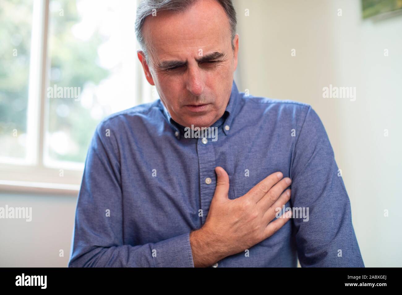 Caucasian man chest pain heart attack hi-res stock photography and ...
