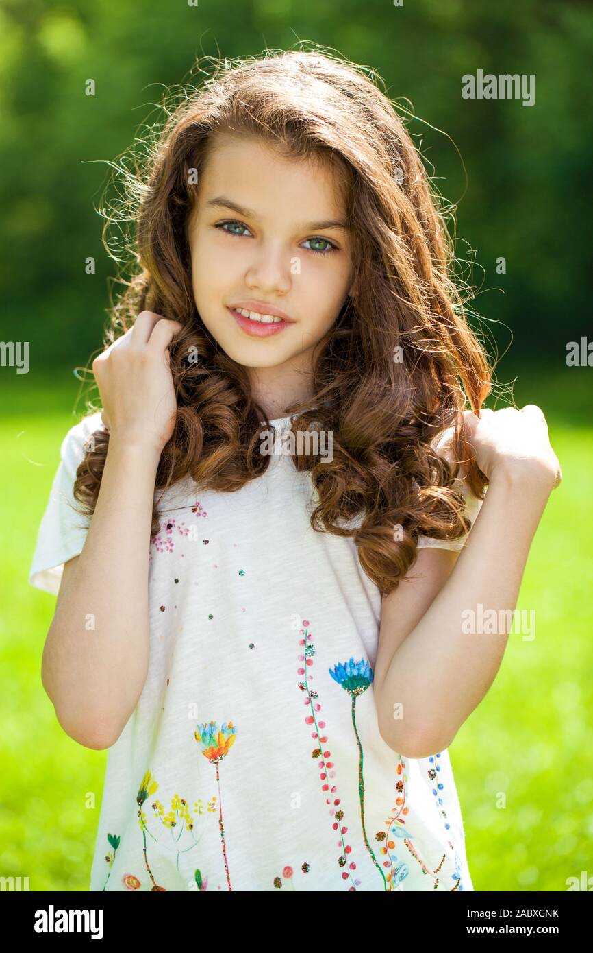 Happy Brunette Little Girl In Summer Park Outdoor Stock Photo Alamy
