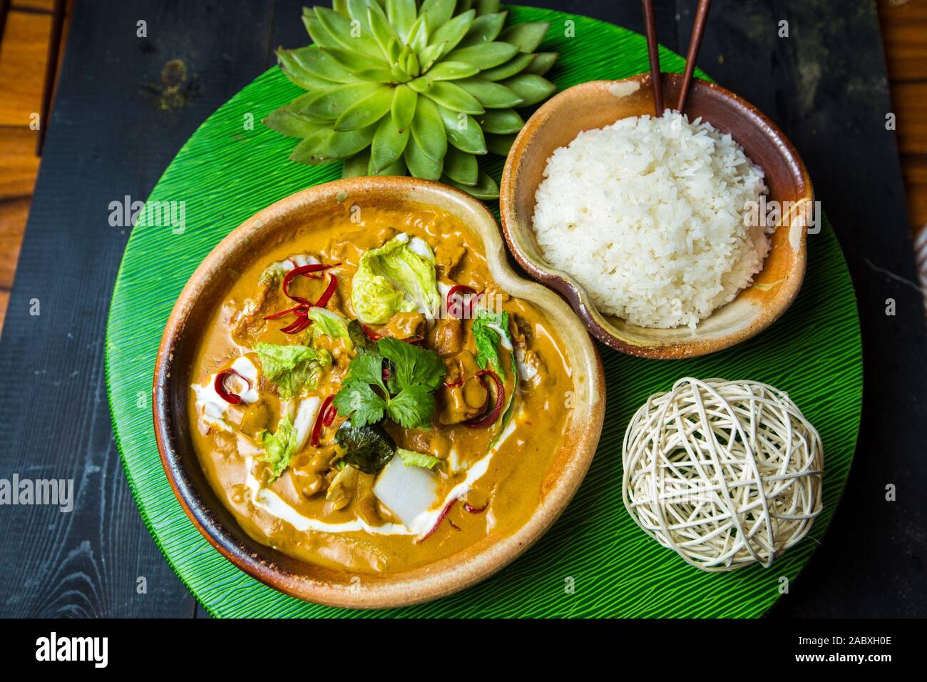 a bowl of chinese chicken curry and rice bowl Stock Photo - Alamy