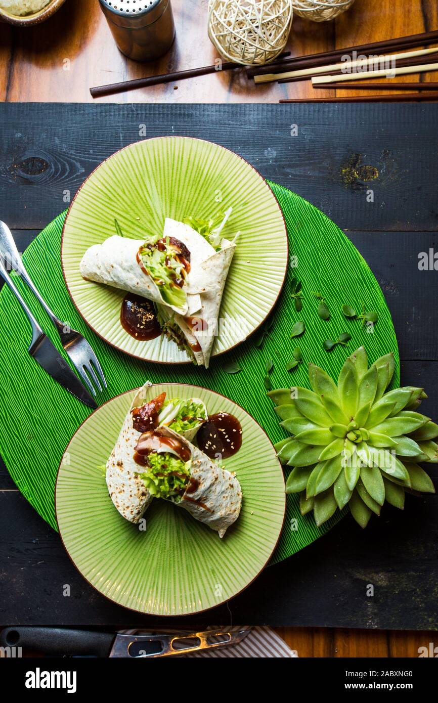 top view of chinese wraps served with soy sauce in sesame Stock Photo ...