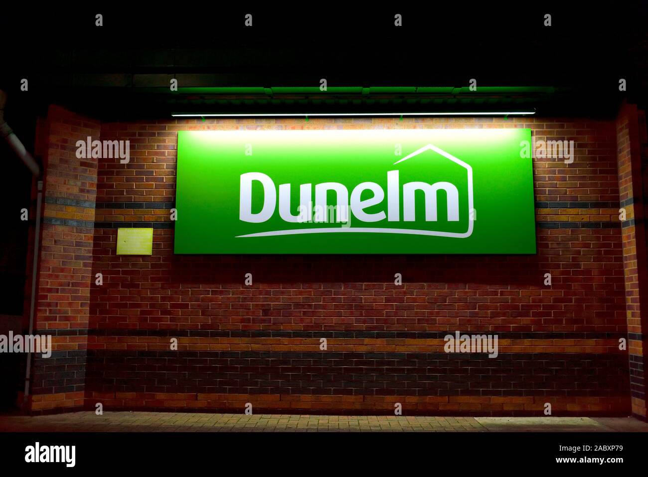 Dunelm shop sign illuminated outside UK Stock Photo - Alamy