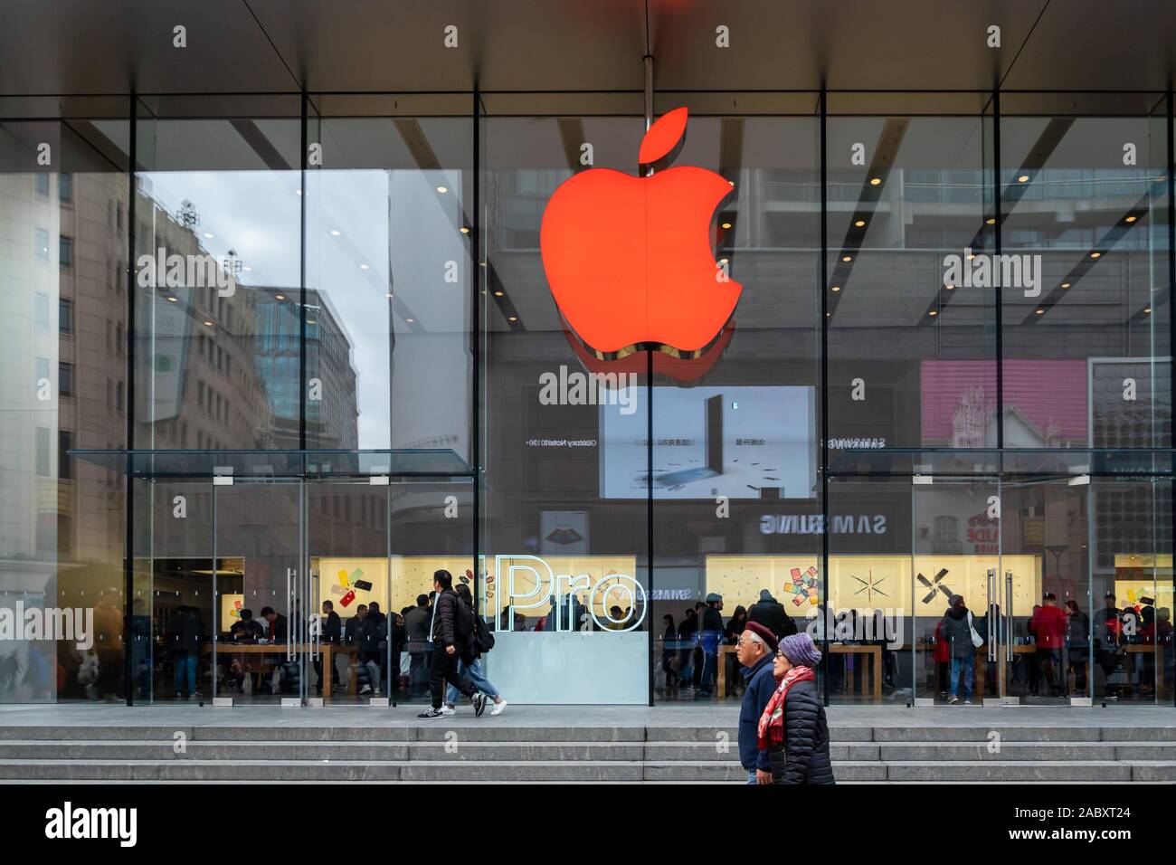 The logo of Apple is lit up in red to mark the upcoming World AIDS Day ...