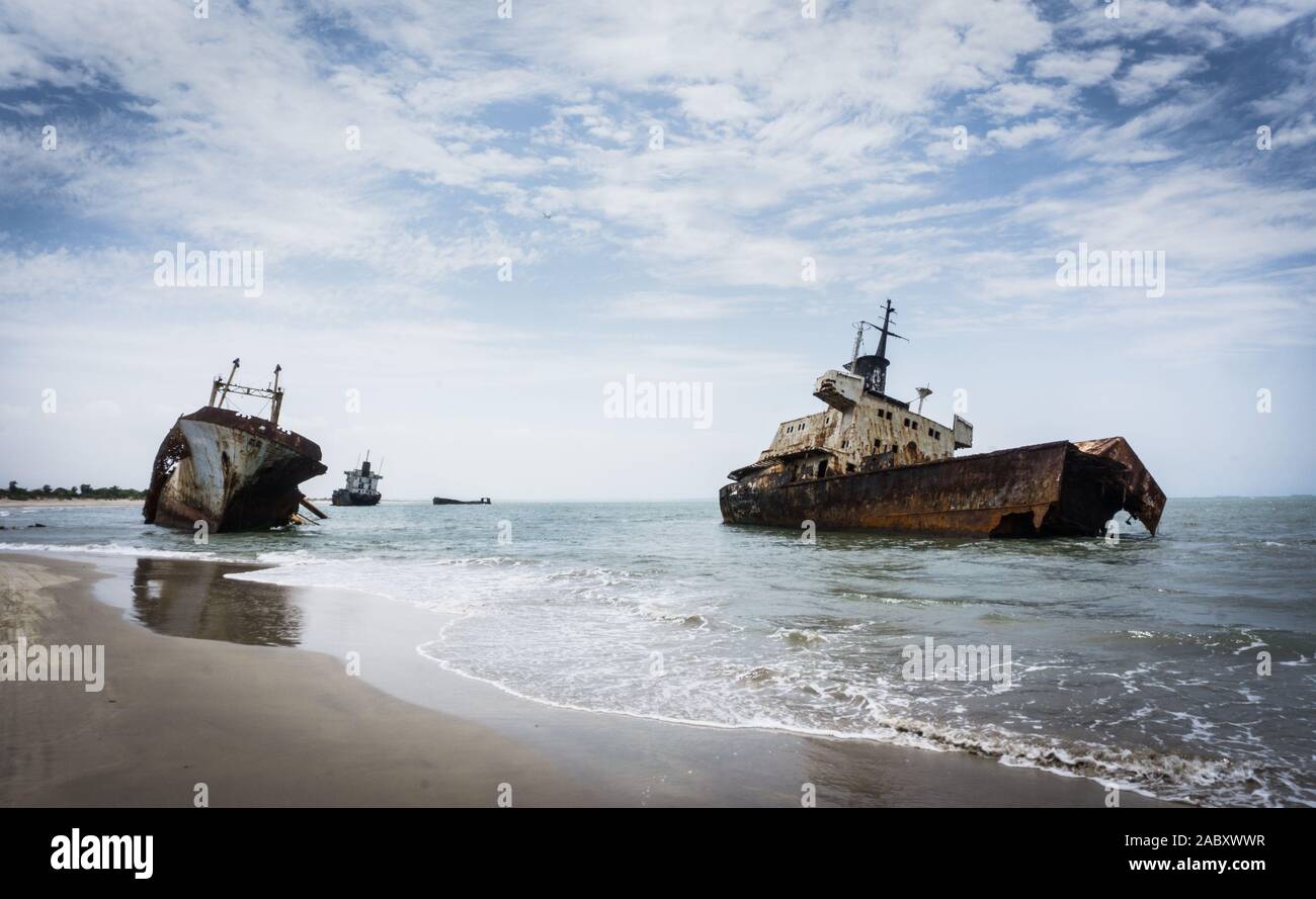 Abandoned ships slowly rust away on a remote beach in Angola Stock ...