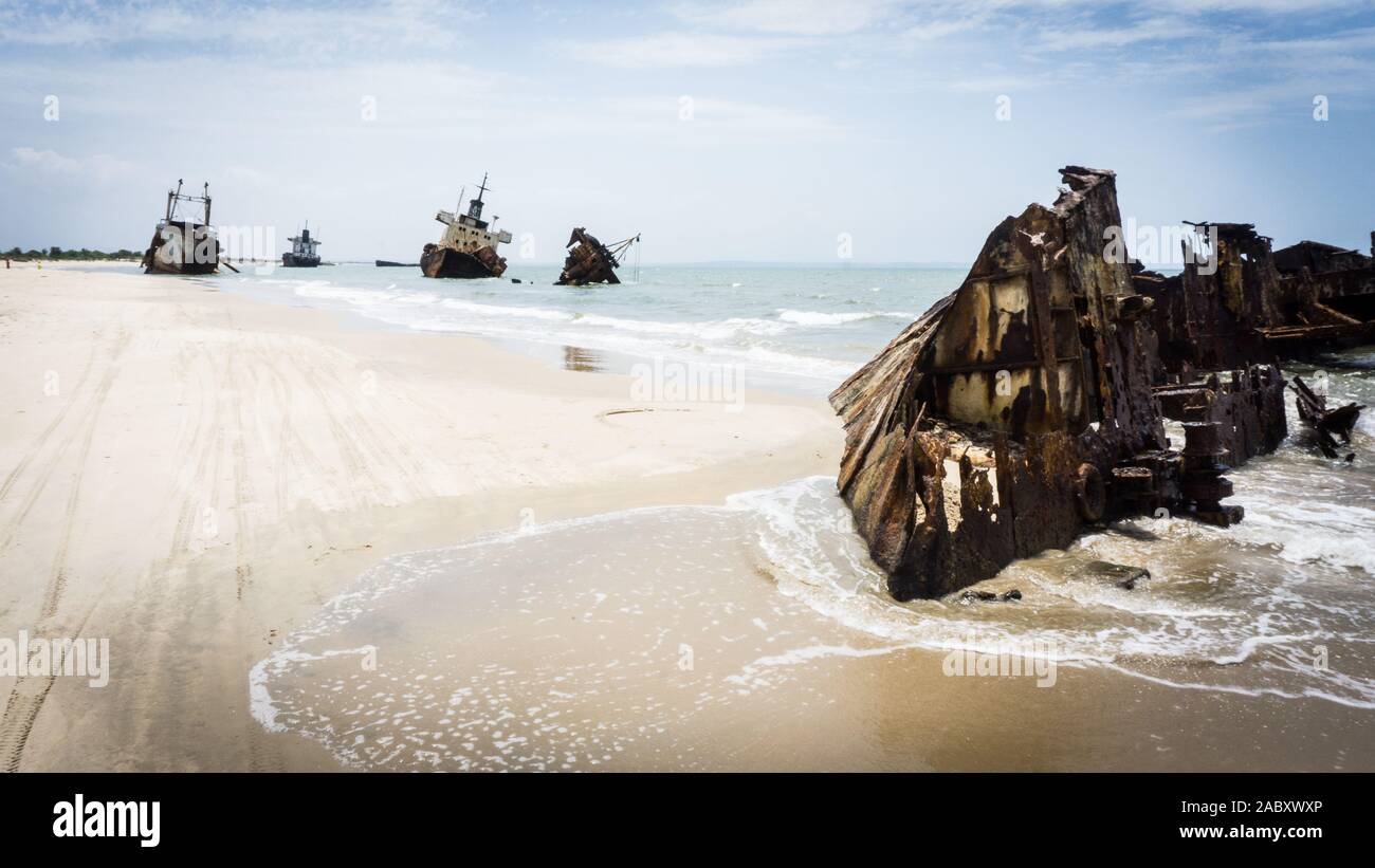 Abandoned ships slowly rust away on a remote beach in Angola Stock ...