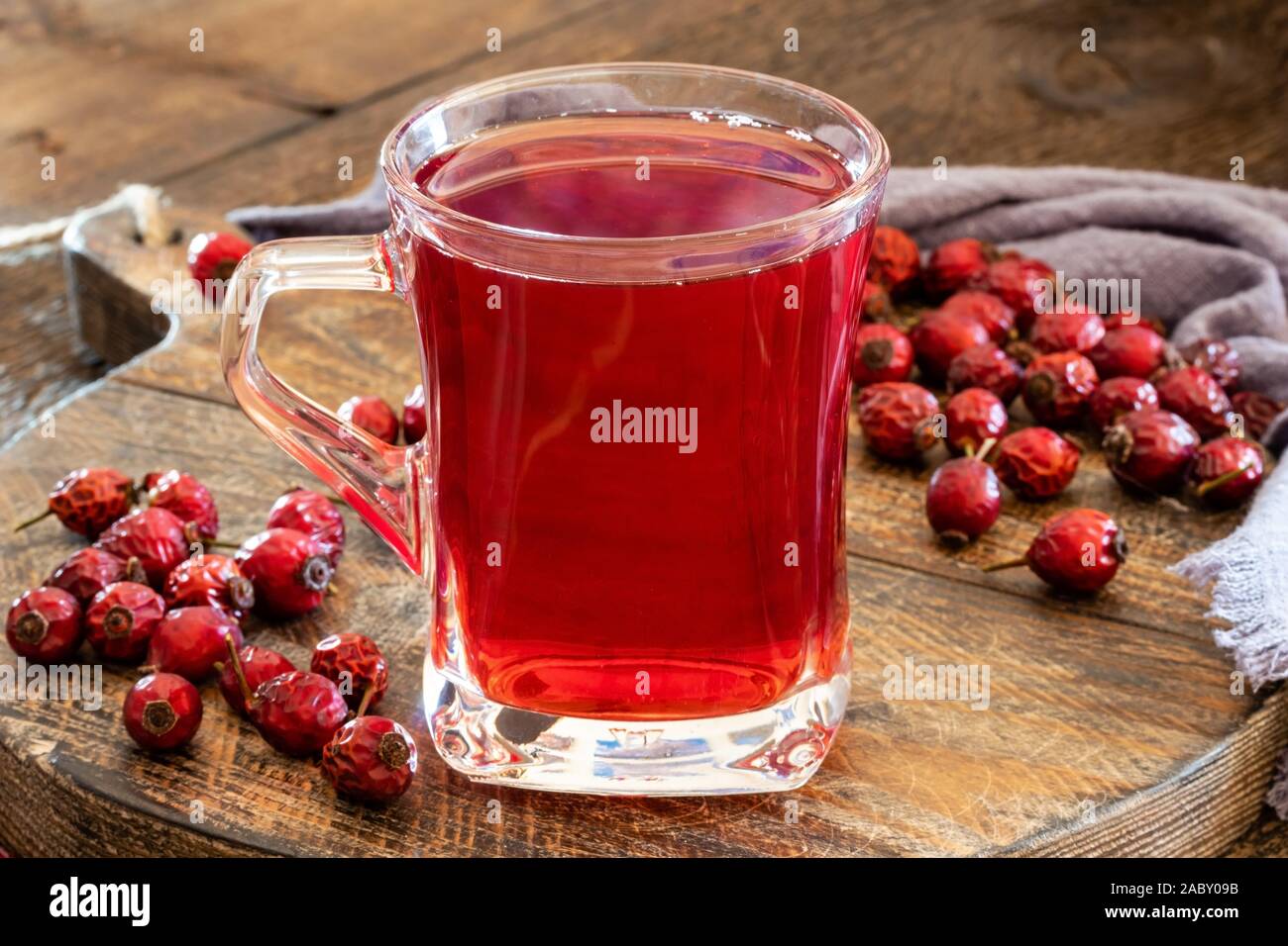Rose hip tea with dried berries on a table Stock Photo - Alamy