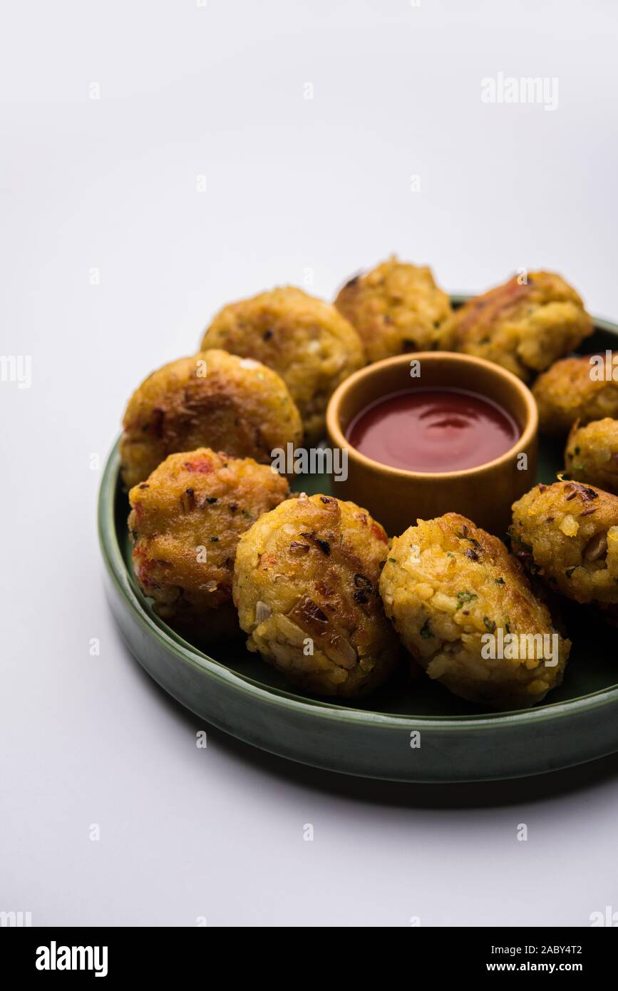 Veg Poha Cutlet or flattened Rice Patties served with tomato ketchup ...