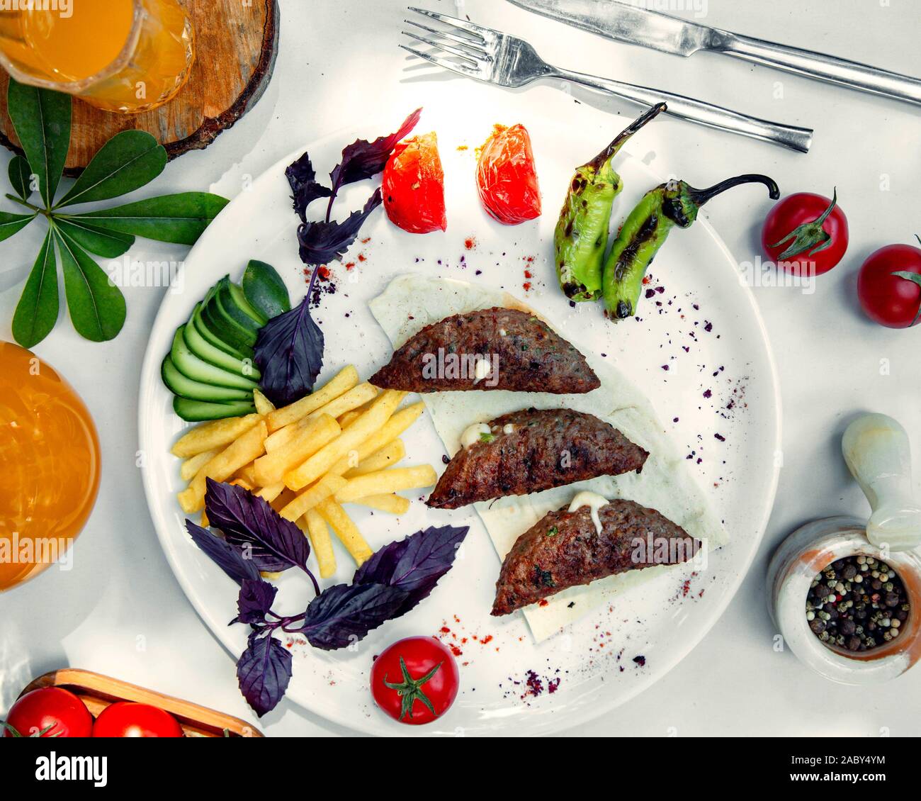 stuffed kebab with cheese, served with fries, grilled and fresh ...