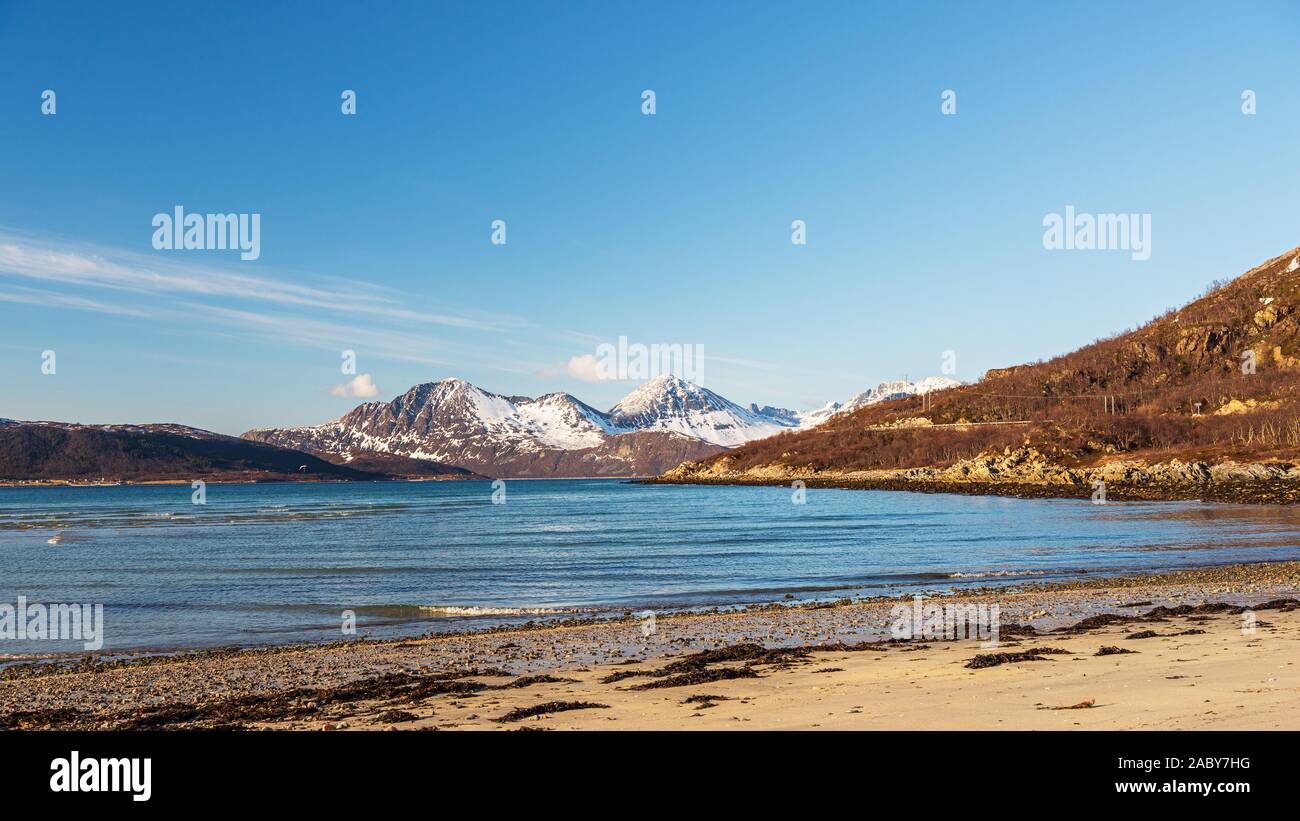 sunset over sandvika beach in Tromso region during a spring afternoon ...