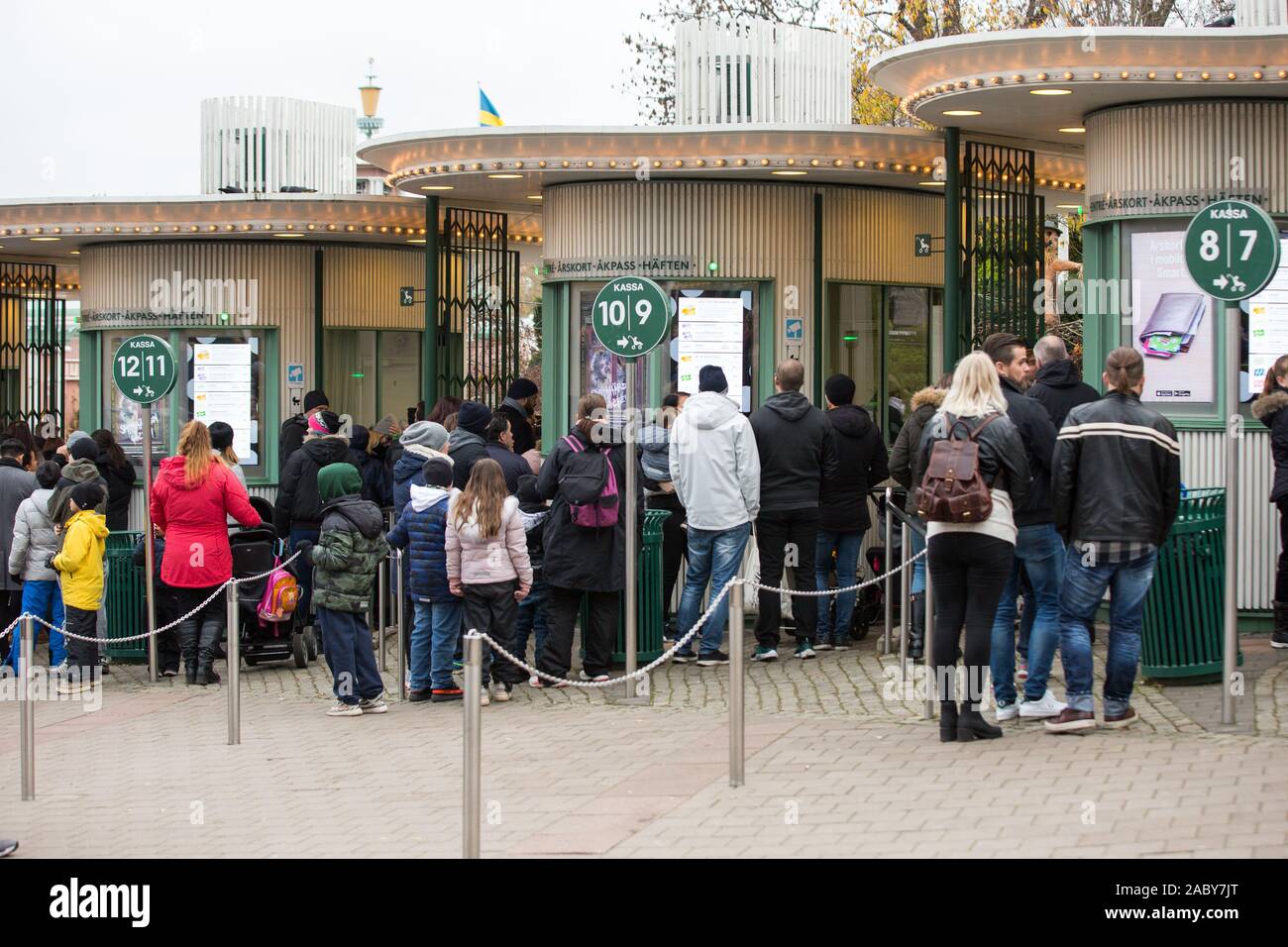 People stand in queues at the ticket office of the Scandinavia's ...