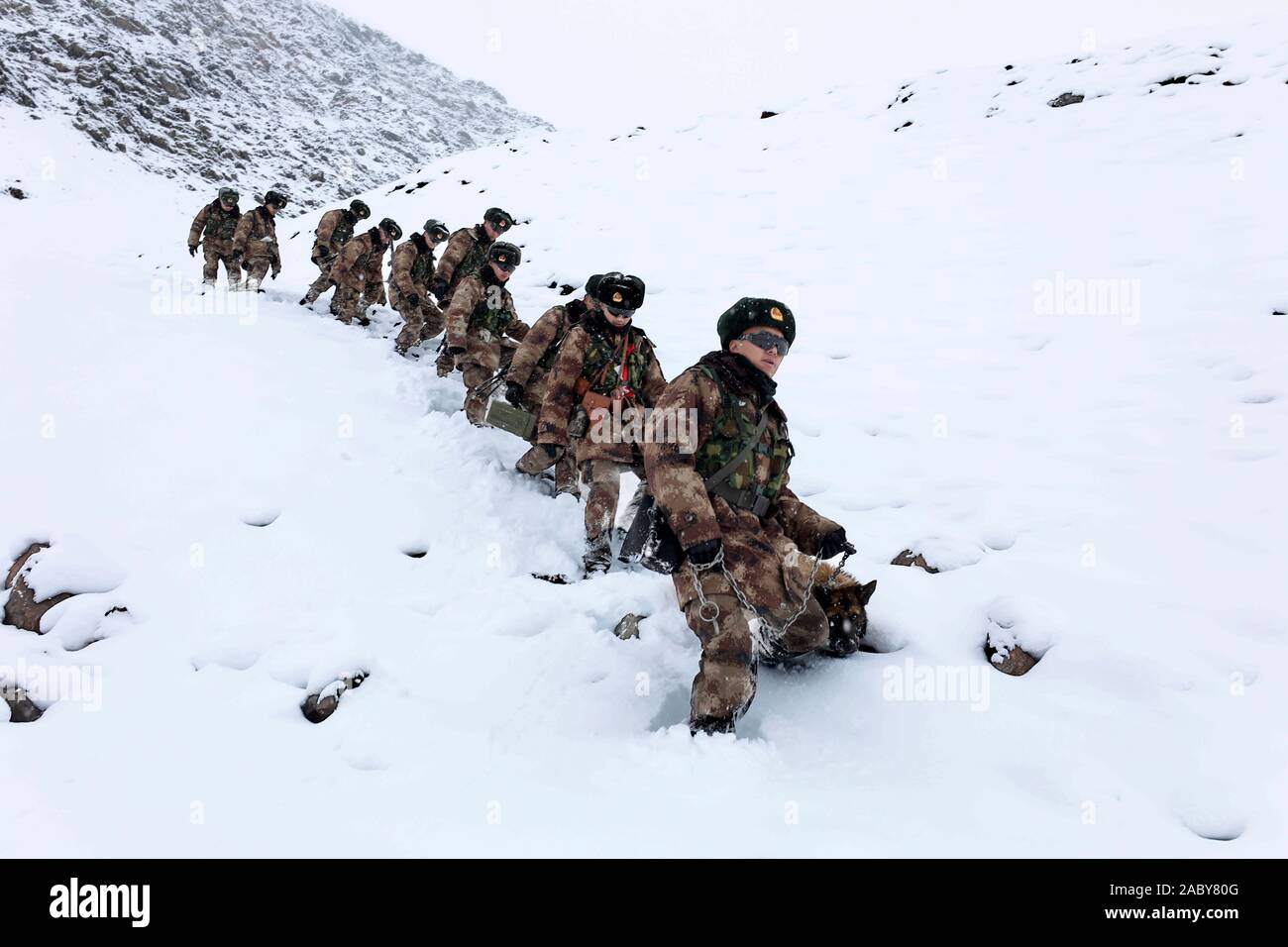 Chinese PLA (People's Liberation Army) soldiers patrol the snow ...